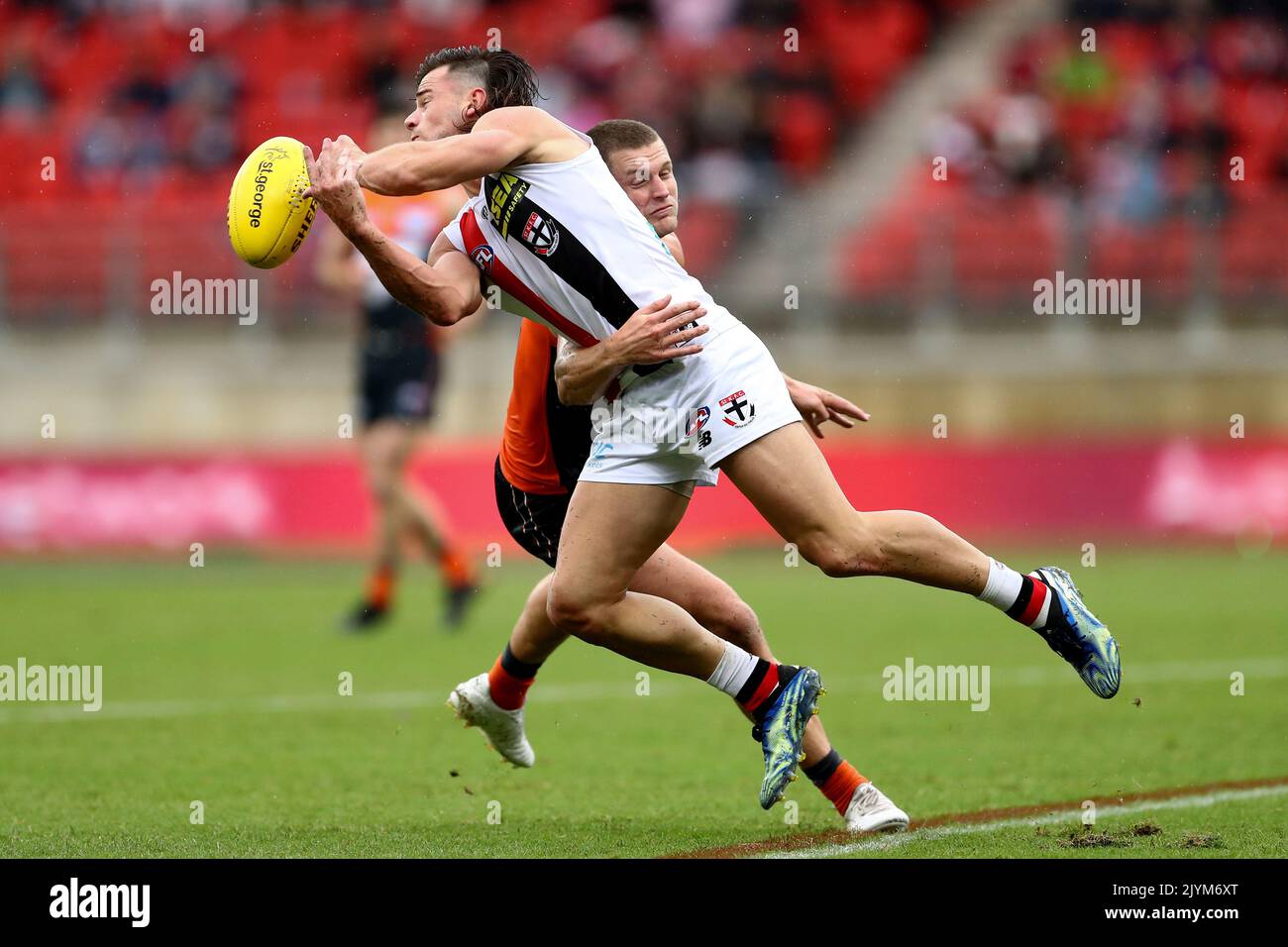 Jack Sinclair of the Saints contests the ball with Jacob Hopper of the ...