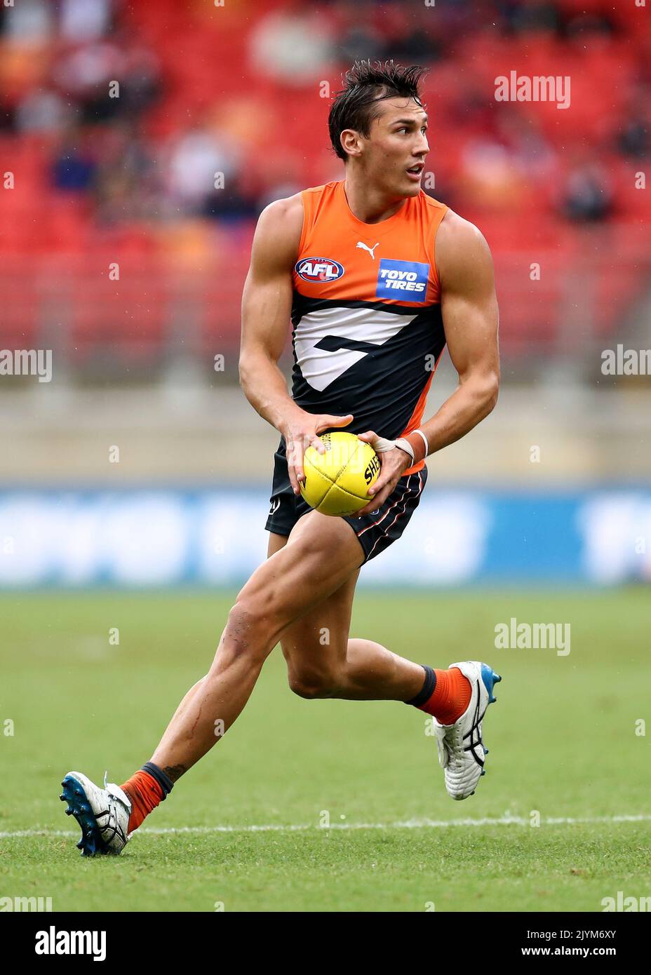 Isaac Cumming of the Giants controls the ball during the Round 1 AFL ...