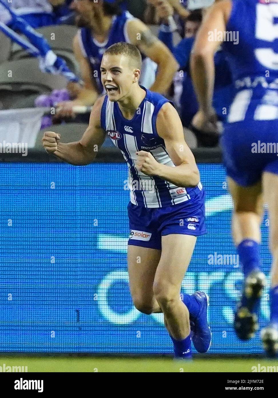 Tom Powell of the Kangaroos celebrates after kicking a goal during the ...
