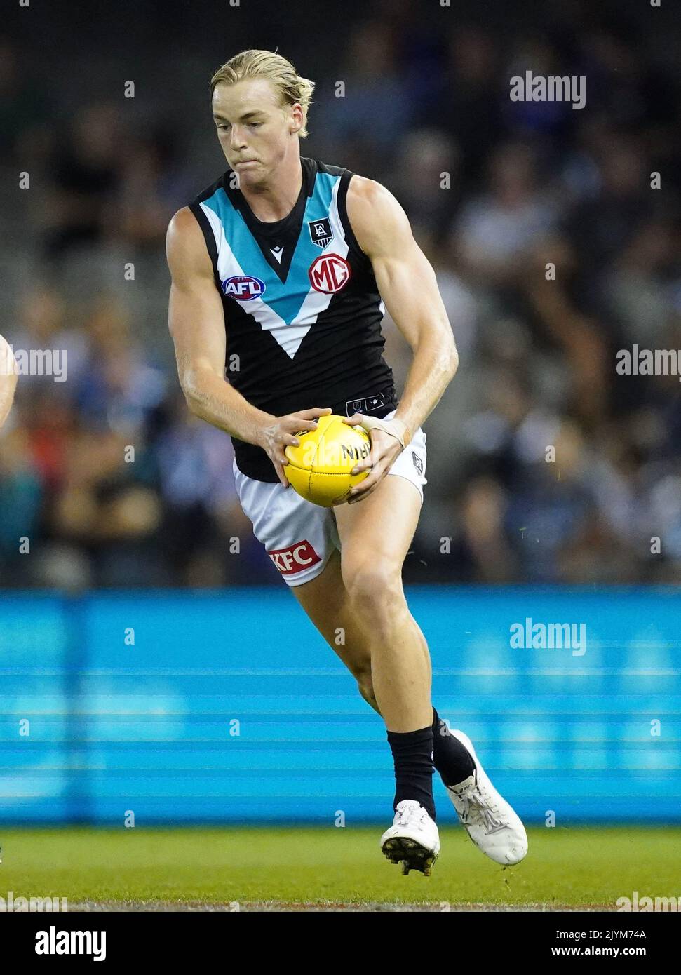 Miles Bergman of the Power runs with the ball during the Round 1 AFL ...