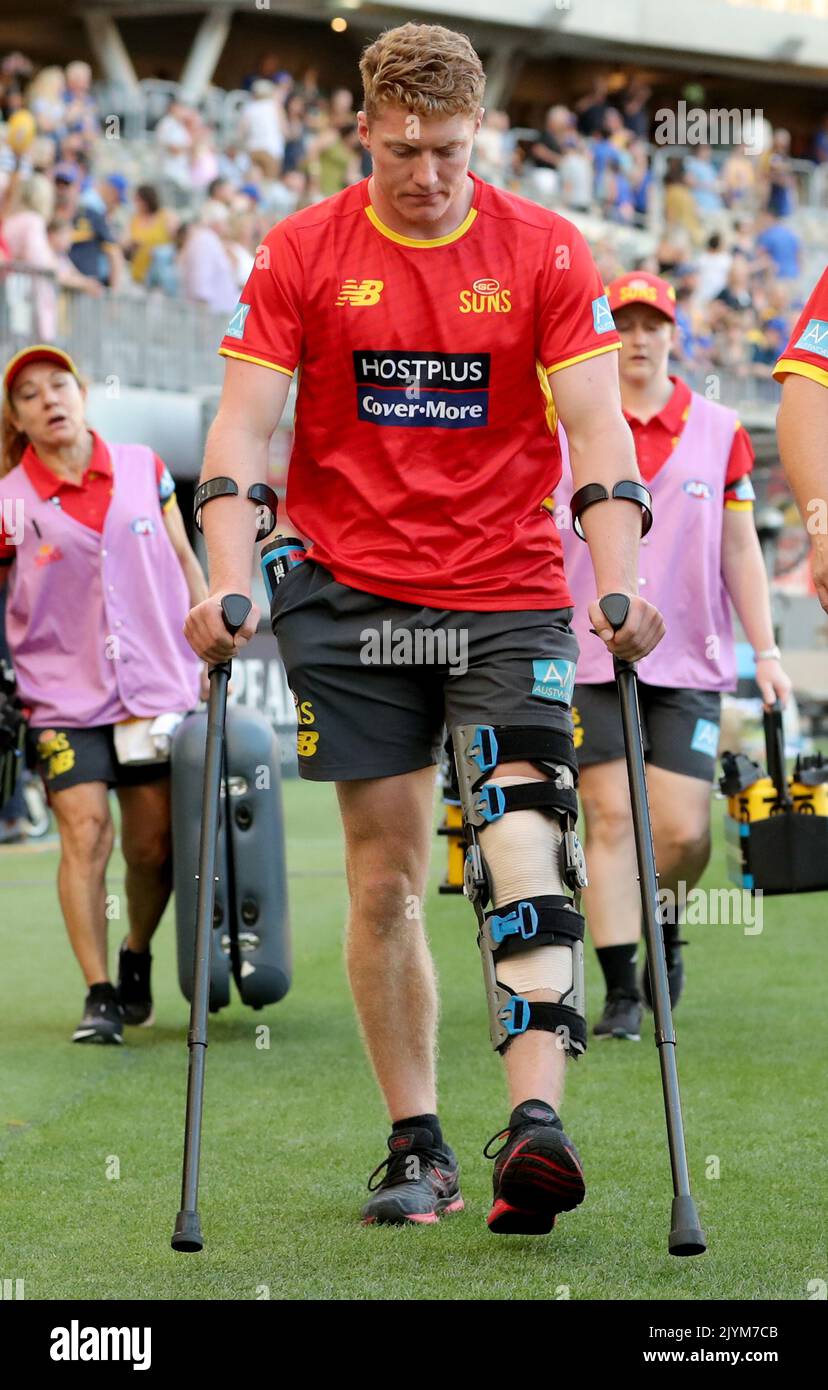 Matt Rowell of the Suns is seen leaving the field injured after the ...