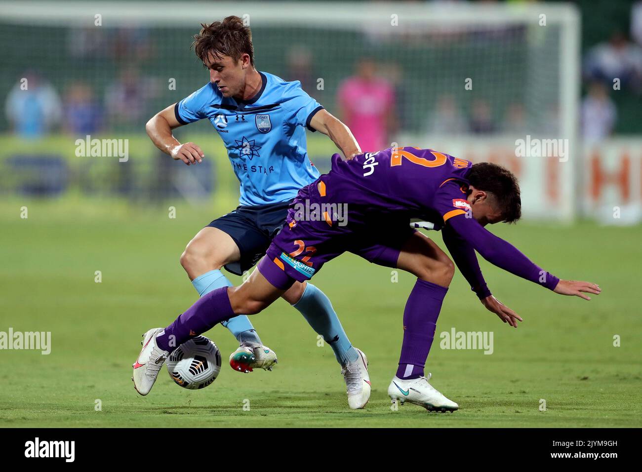 Joel King of Sydney FC and Joshua Rawlins of the Glory compete for the ...