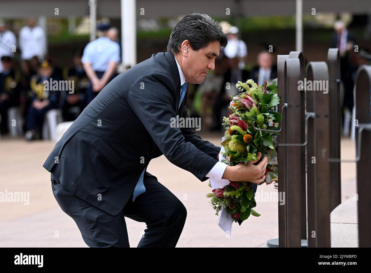 NSW Minister Geoff Lee is seen laying a wreath on behalf of the NSW ...
