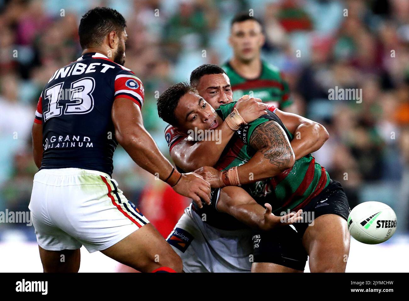 Tevita Tatola of the Rabbitohs offloads during the Round 3 NRL match ...