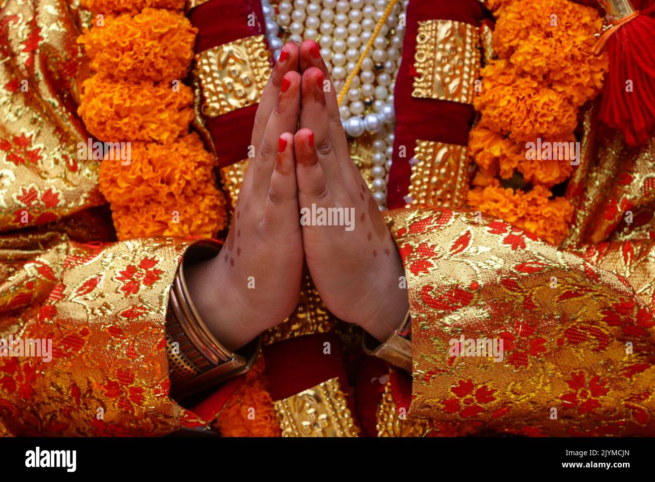 Children dressed as living goddess "Kumari" praying while taking part ...