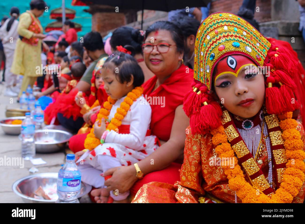 Children dressed as living goddess "Kumari" pose for photos while ...