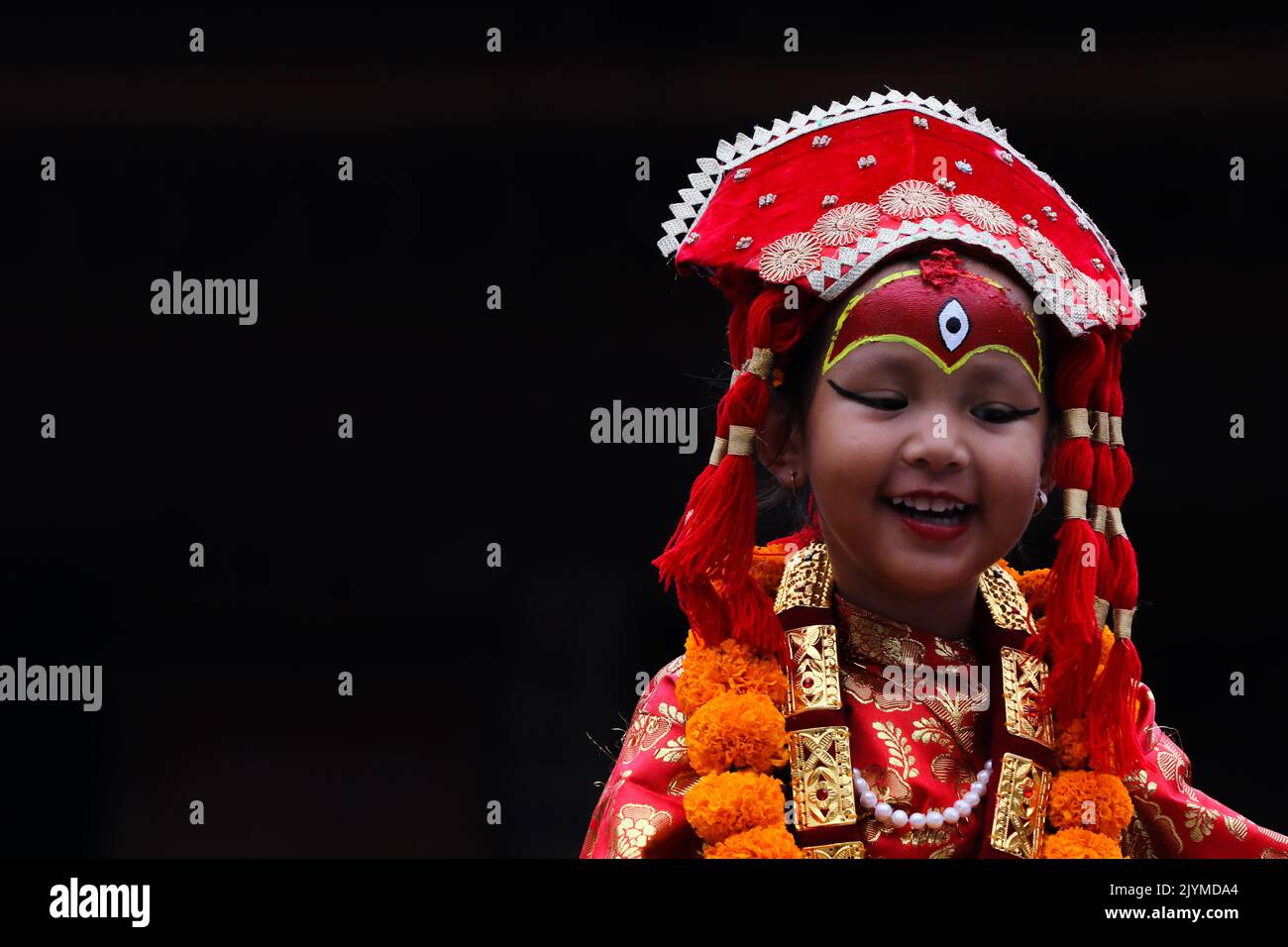 Children dressed as living goddess "Kumari" pose for photos while ...
