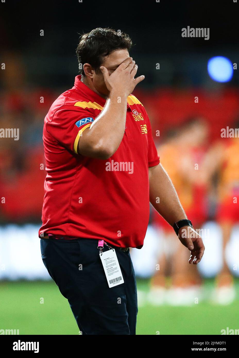 Suns Coach Stuart Dew looks on during the Round 2 AFL match between the ...