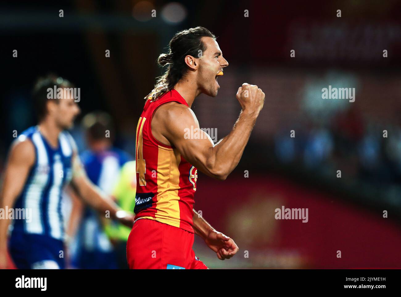 Lachie Weller of the Suns celebrates a goal during the Round 2 AFL ...