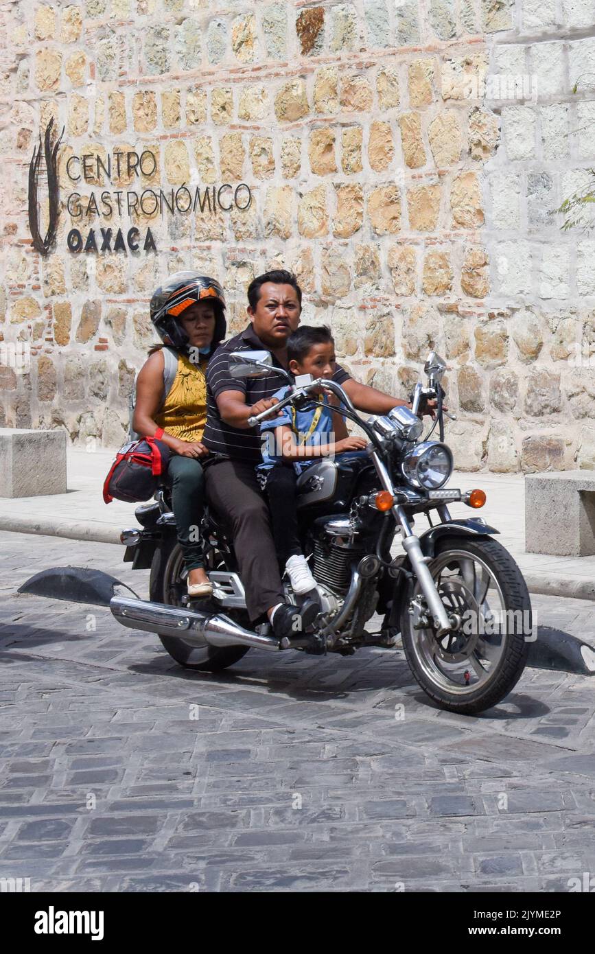 Mexican family riding a motorcycle, Oaxaca de Juarez, Mexico Stock ...
