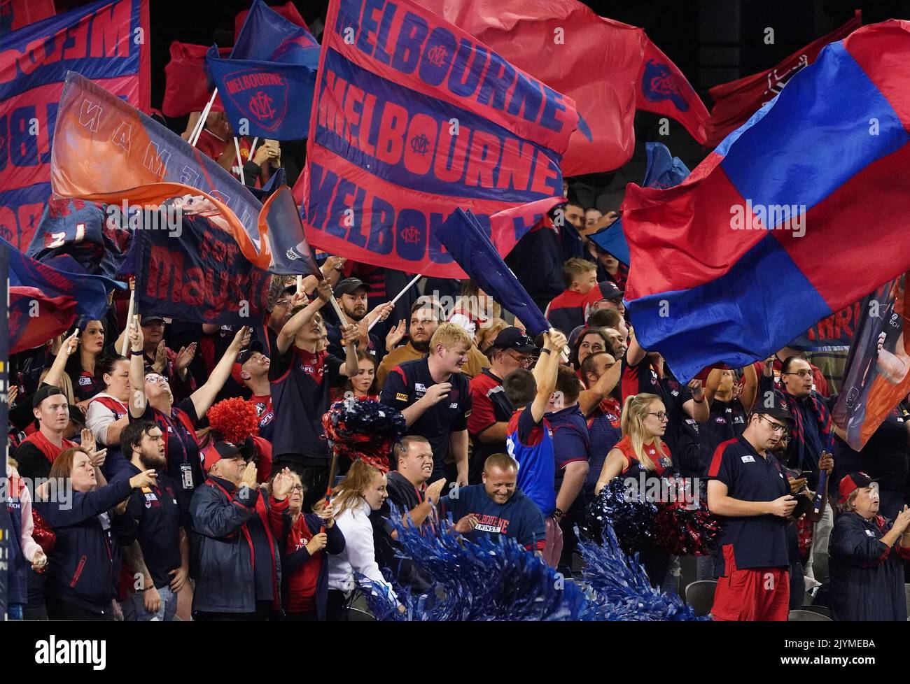 Demons fans in the crowd celebrates after winning the Round 2 AFL match ...