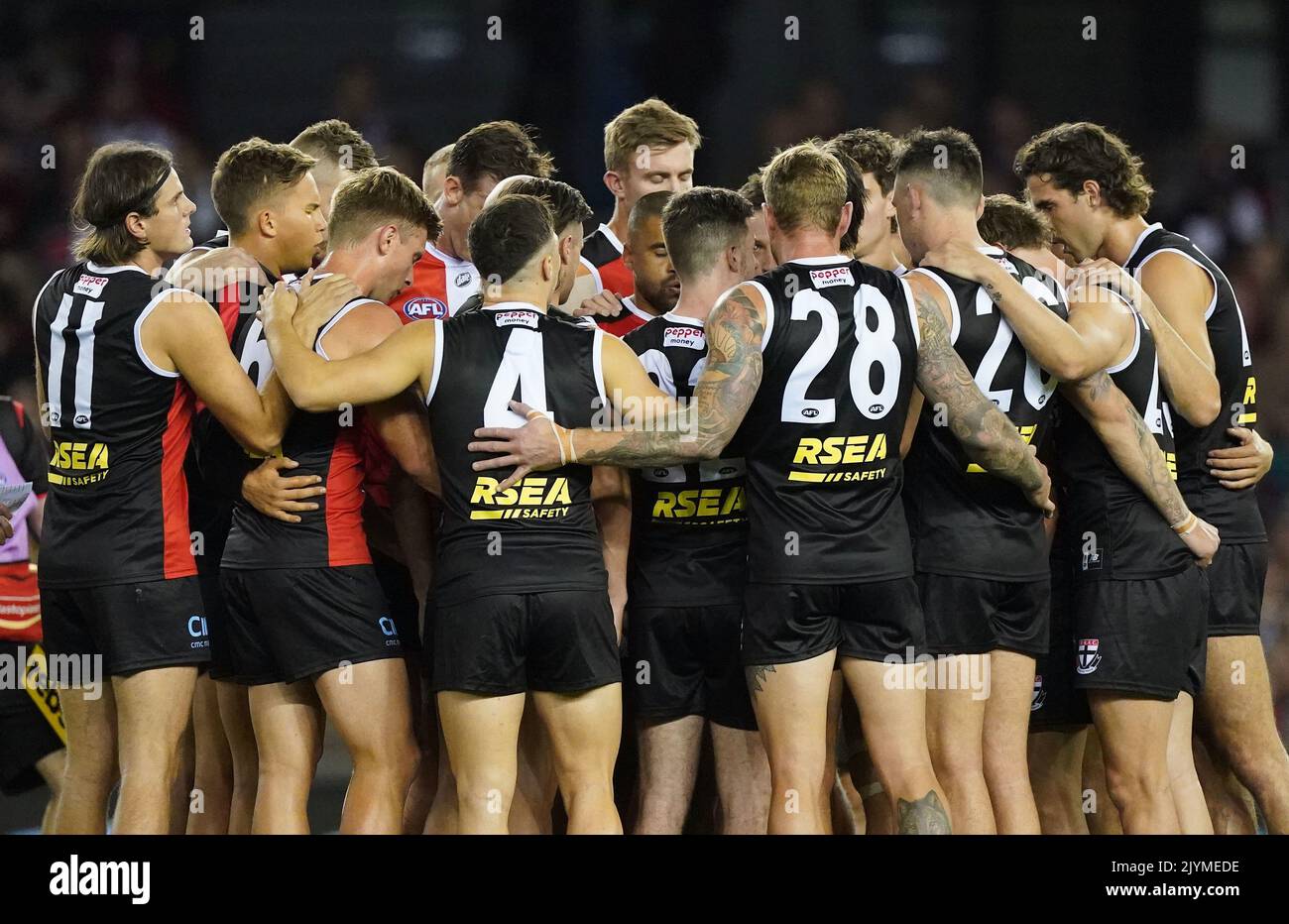 The Saints form a team huddle during the Round 2 AFL match between the ...