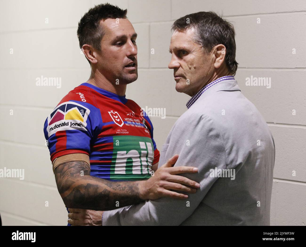 Mitchell Pearce embraces his father Wayne Pearce after the round 3 NRL ...