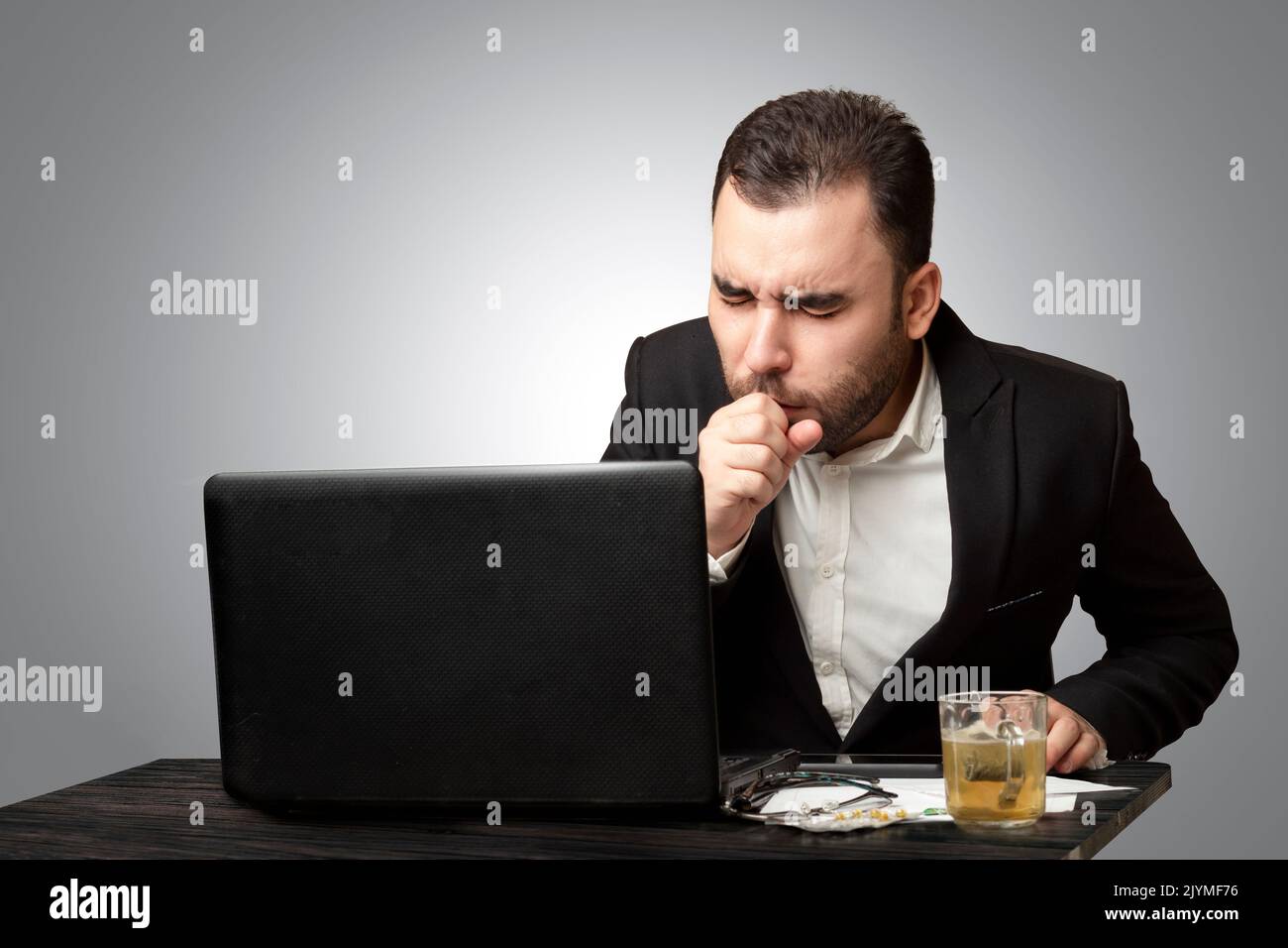 Sick employee coughing at work, isolated background Stock Photo - Alamy