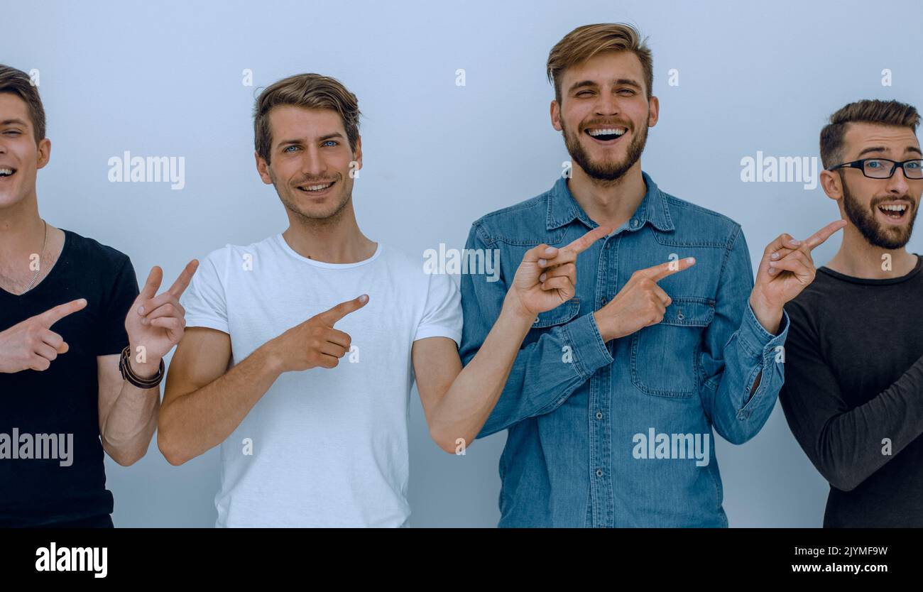 smiling friends pointing at something Stock Photo - Alamy