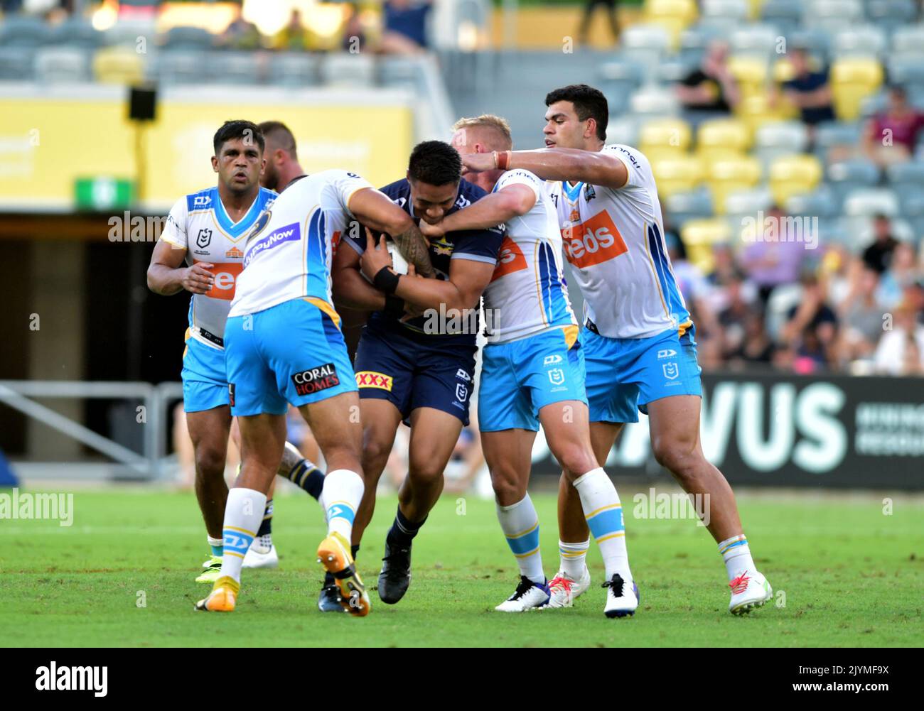 Murray Taulagi ploughs through Titans defenders during the Round 3 NRL ...