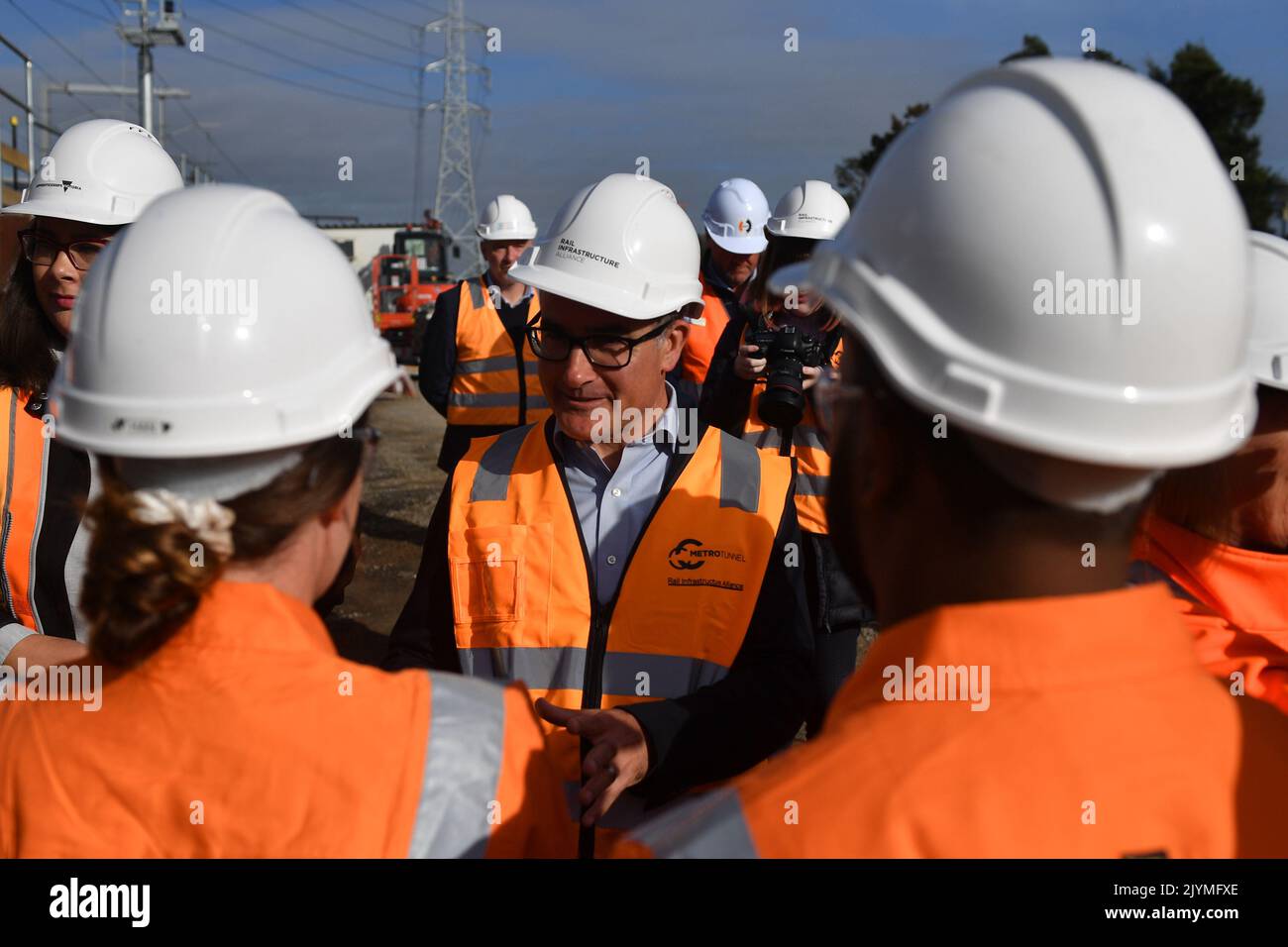 Acting Victorian Premier James Merlino (centre) speaks with ...