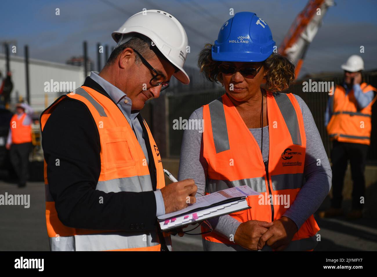 Acting Victorian Premier James Merlino (centre) tours a construction ...