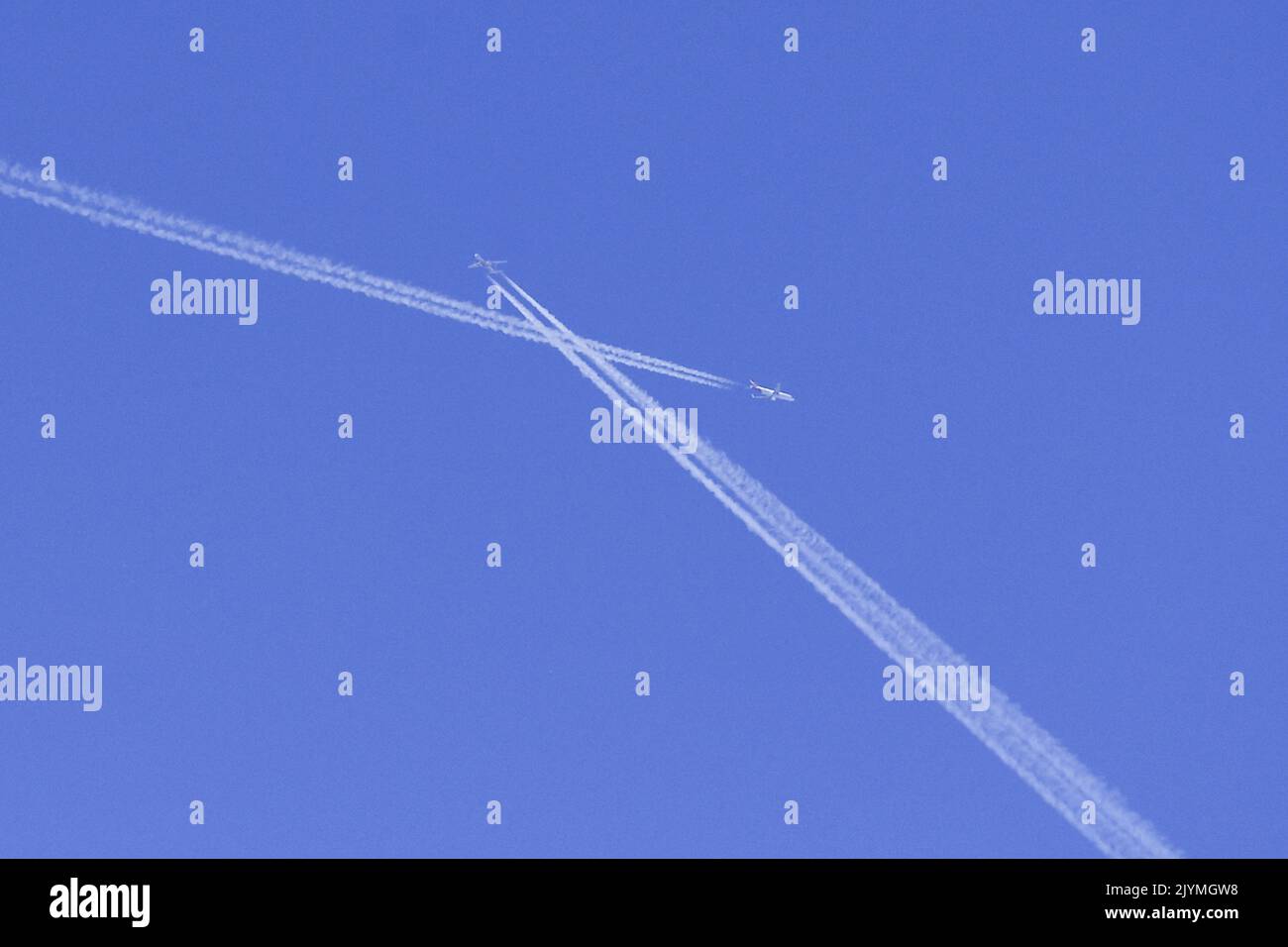 Two commercial planes cross flight path over Canberra, Wednesday, March ...
