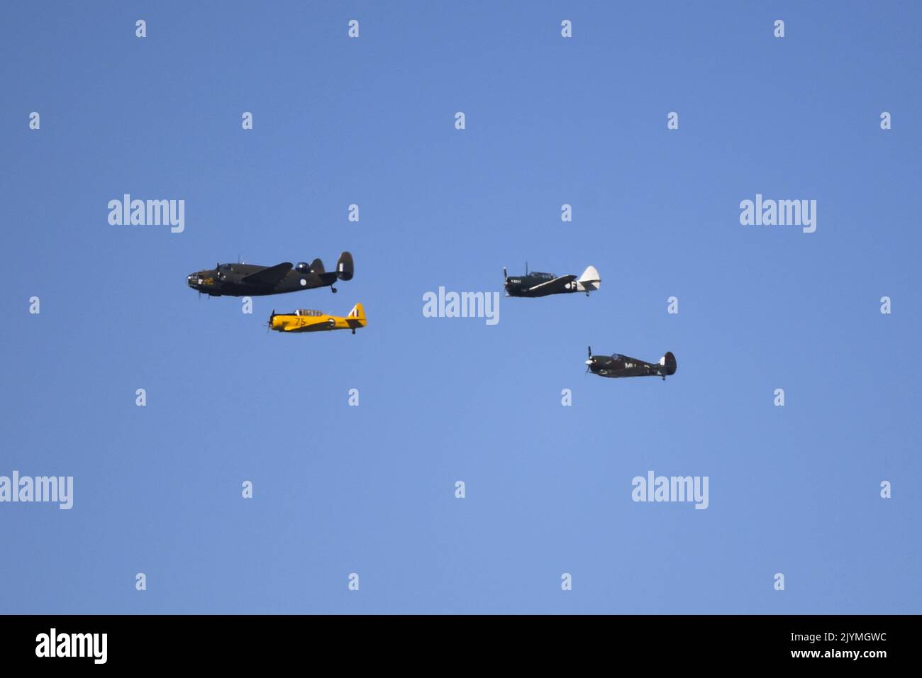 World War II aircrafts perform a fly past over Parliament House marking ...