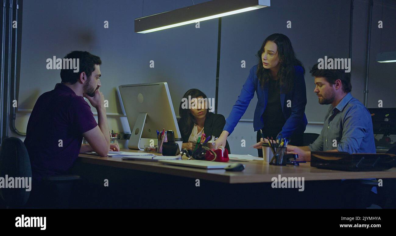 Female executive leading team in meeting. Businesswoman speaking in ...