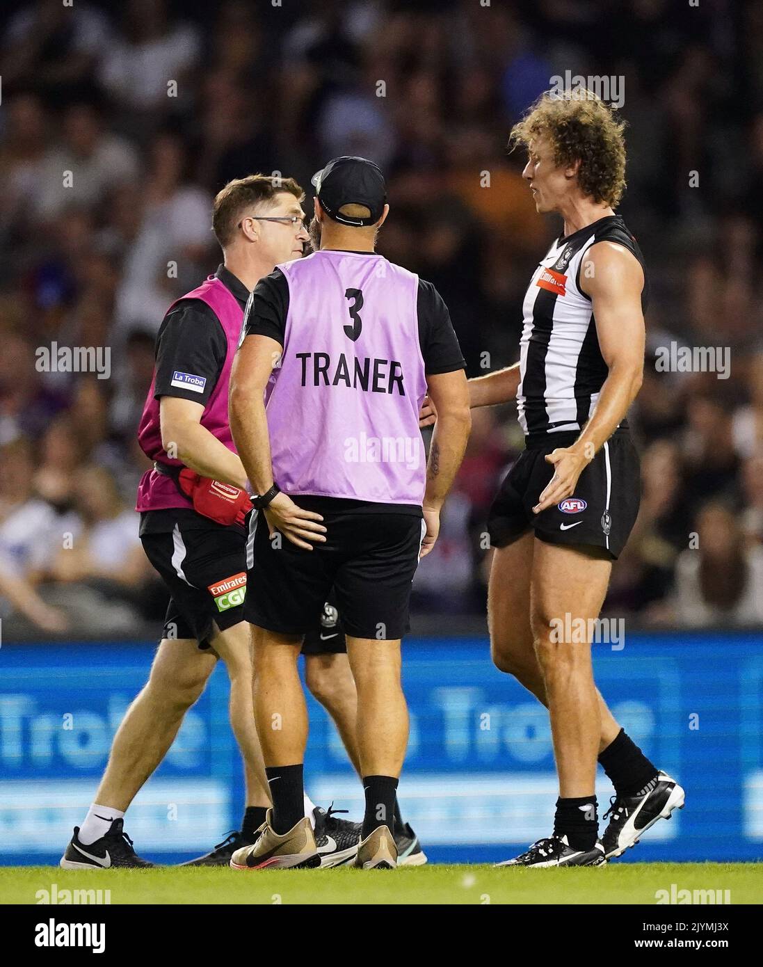 Chris Mayne of the Magpies reacts after being tackled by Charlie ...