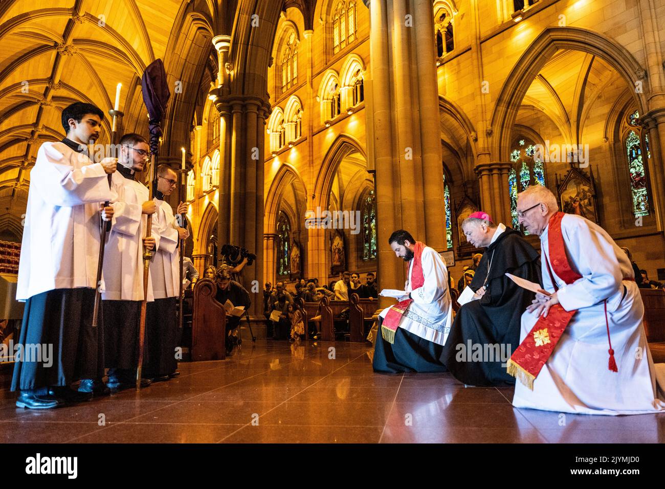 The procession travelling around the Cathedral during the Stations of ...