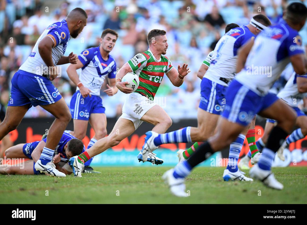Damien Cook of the Rabbitohs makes a break during the Round 4 NRL match ...