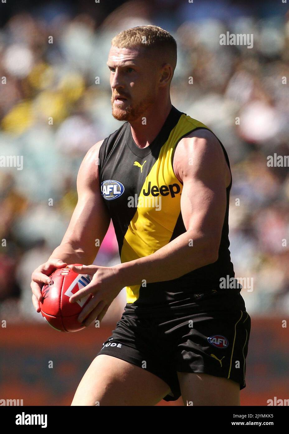 Josh Caddy of the Tigers runs forward during the Round 3 AFL match ...