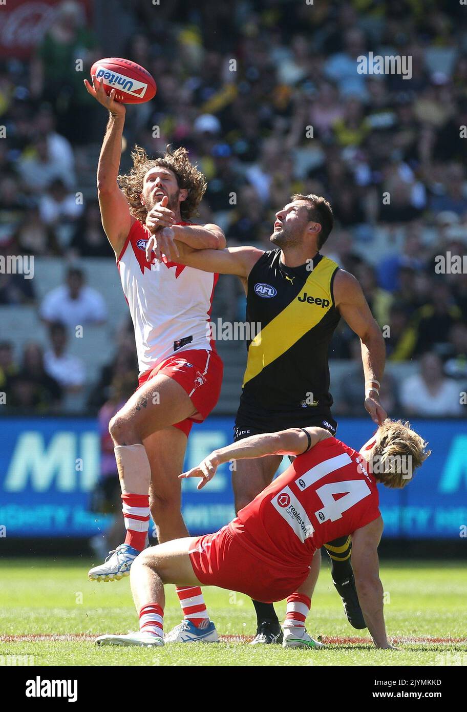 Tom Hickey of the Swans (left) contests ruck against Toby Nankervis of ...