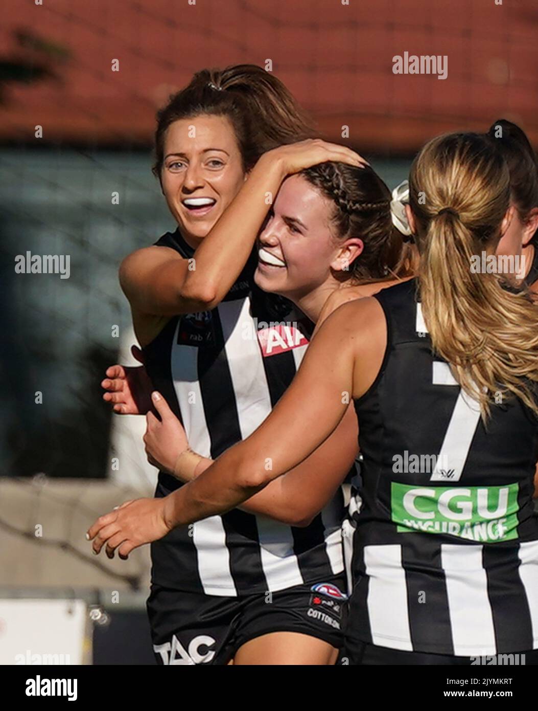 Tarni Brown of the Magpies is congratulated by Stephanie Chiocci after ...