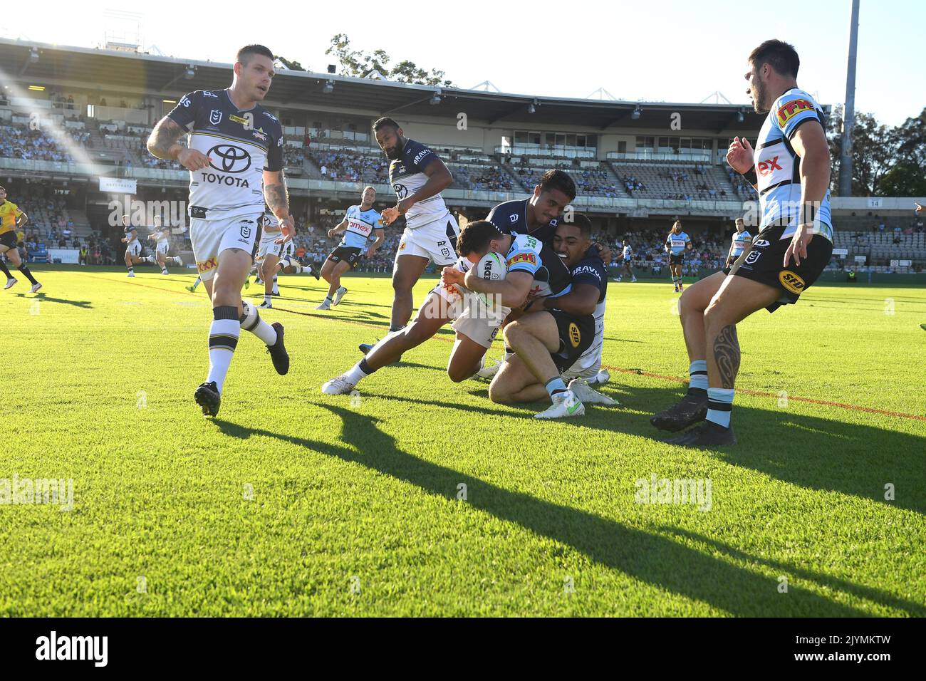 Connor Tracey of the Sharks is tackled during the Round 4 NRL match ...