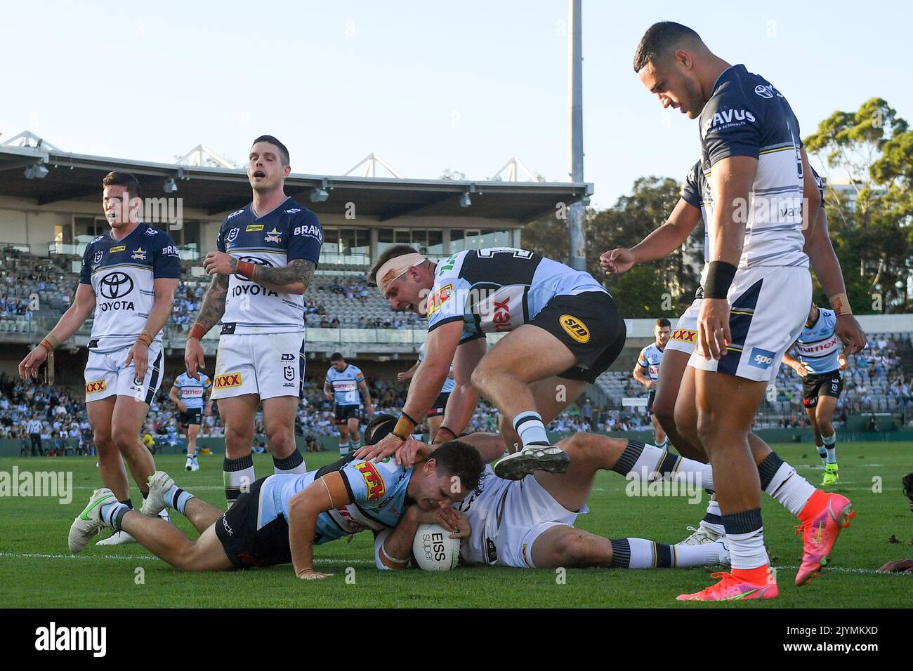 Connor Tracey of the Sharks scores a try during the Round 4 NRL match ...