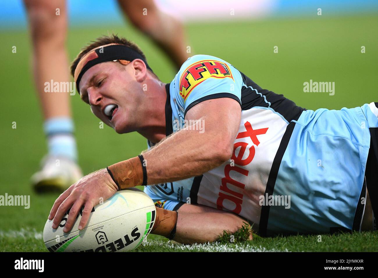 Teig Wilton of the Sharks scores a try during the Round 4 NRL match ...