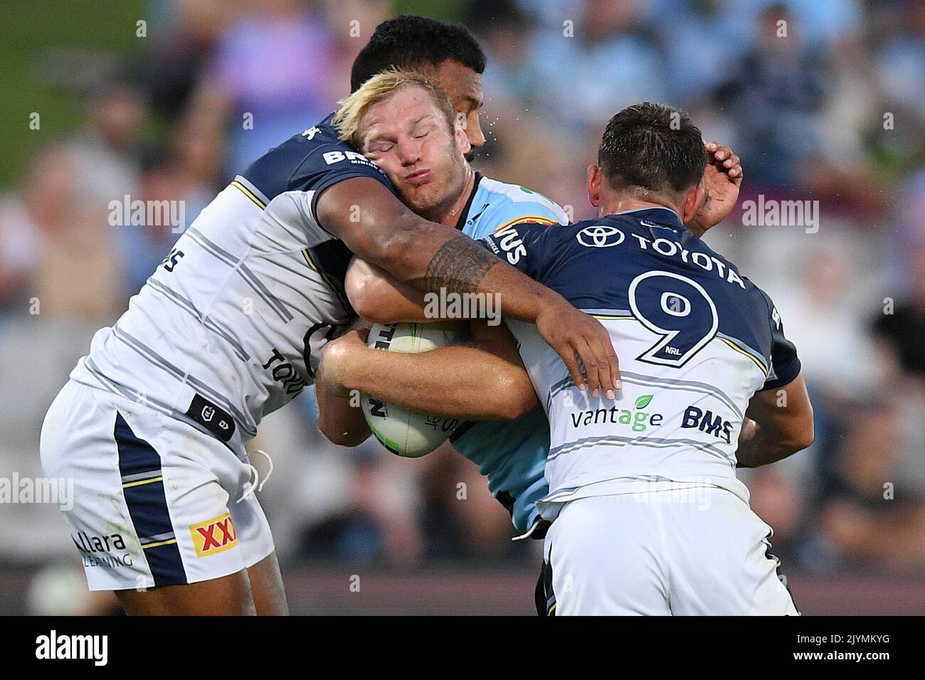 Aiden Tolman of the Sharks is tackled by Francis Molo (left) and Reece ...