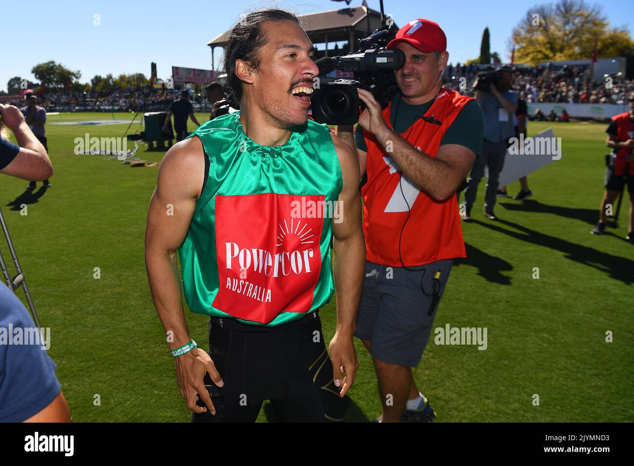 Edward Ware (left) after winning the Powercor Stawell Gift 120m final ...