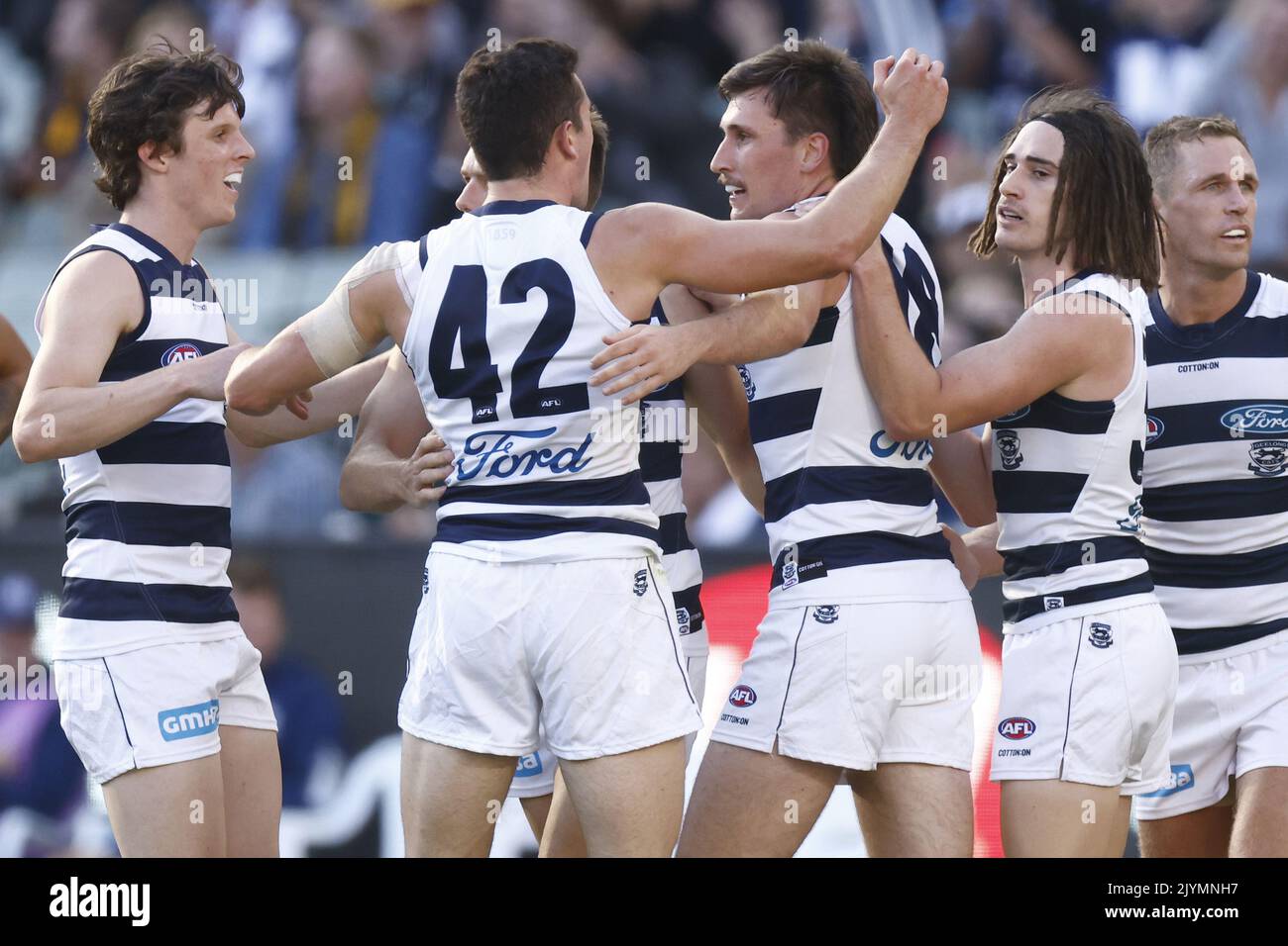 Charlie Constable of the Cats (centre) celebrates a goal during the ...