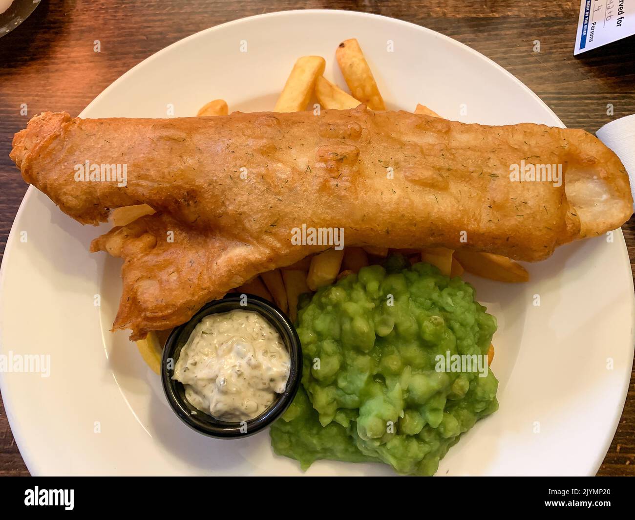 Totnes, South Devon, UK. 24th July, 2022. Fish and chips served in the ...