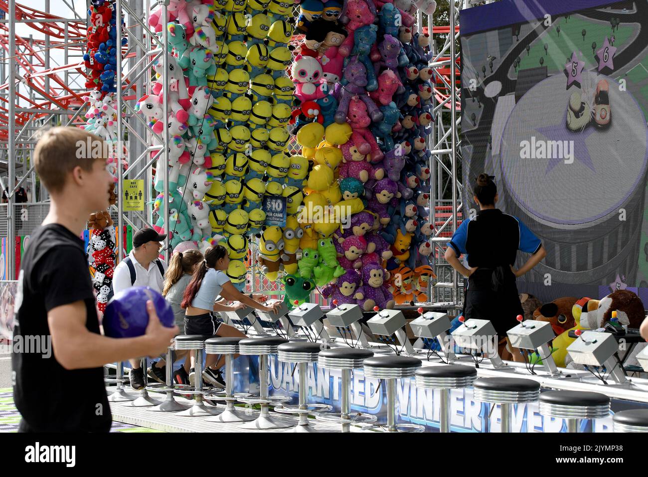 People play sideshow games at the Sydney Royal Easter show in Sydney ...