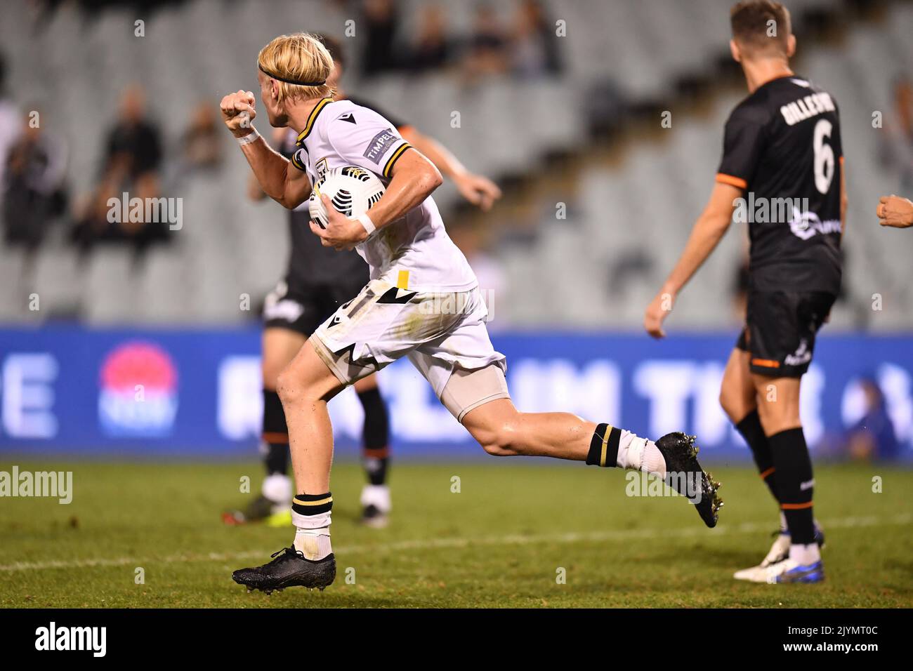 Lachlan Rose of Macarthur briefly celebrates his goal as he runs the ...