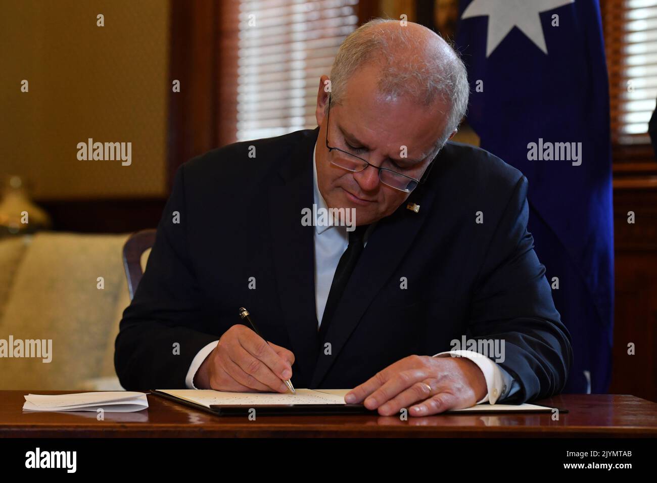 Prime Minister Scott Morrison signs a condolence book at Admiralty ...