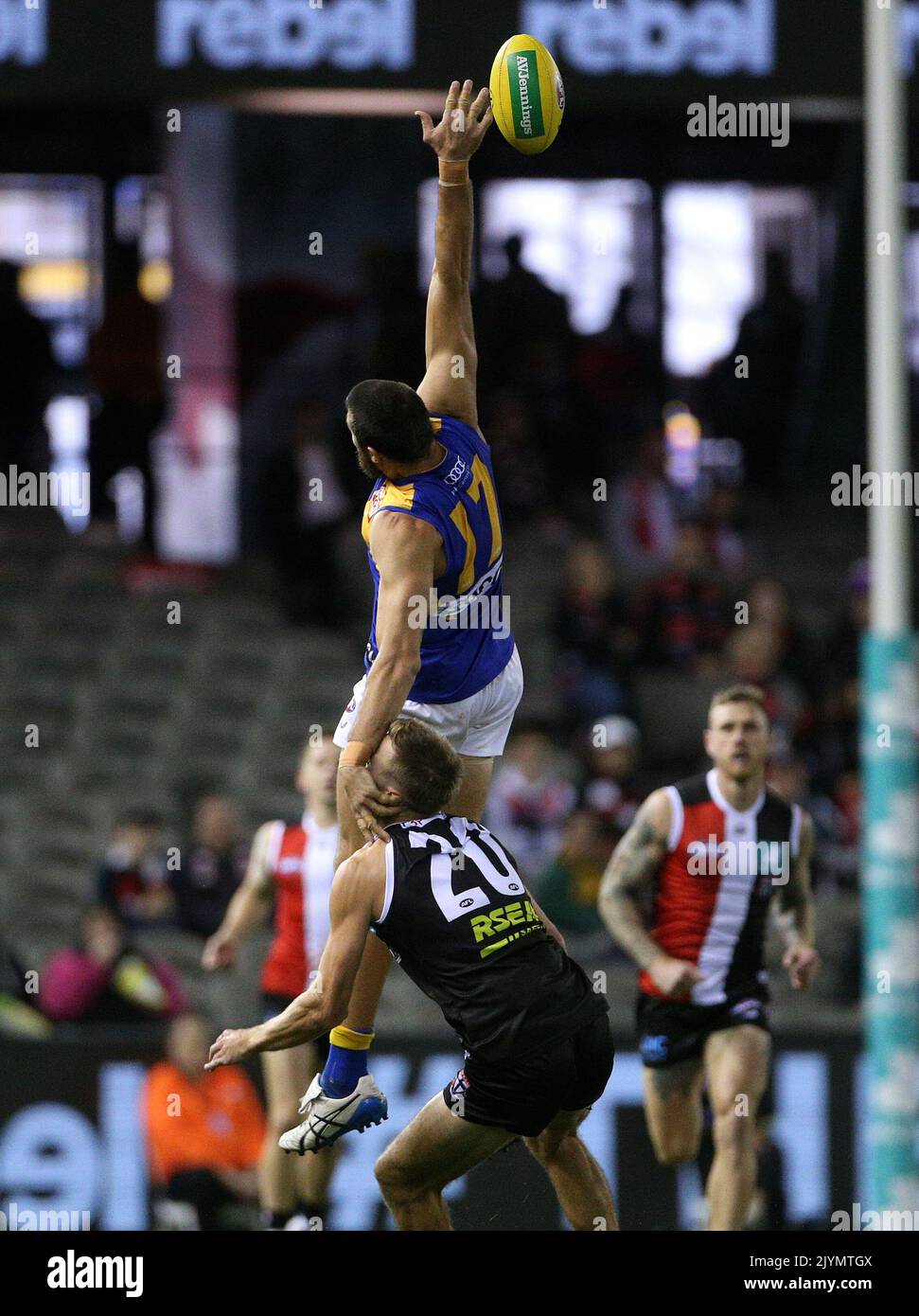 Josh Kennedy of the Eagles flies over Dougal Howard of the Saints ...