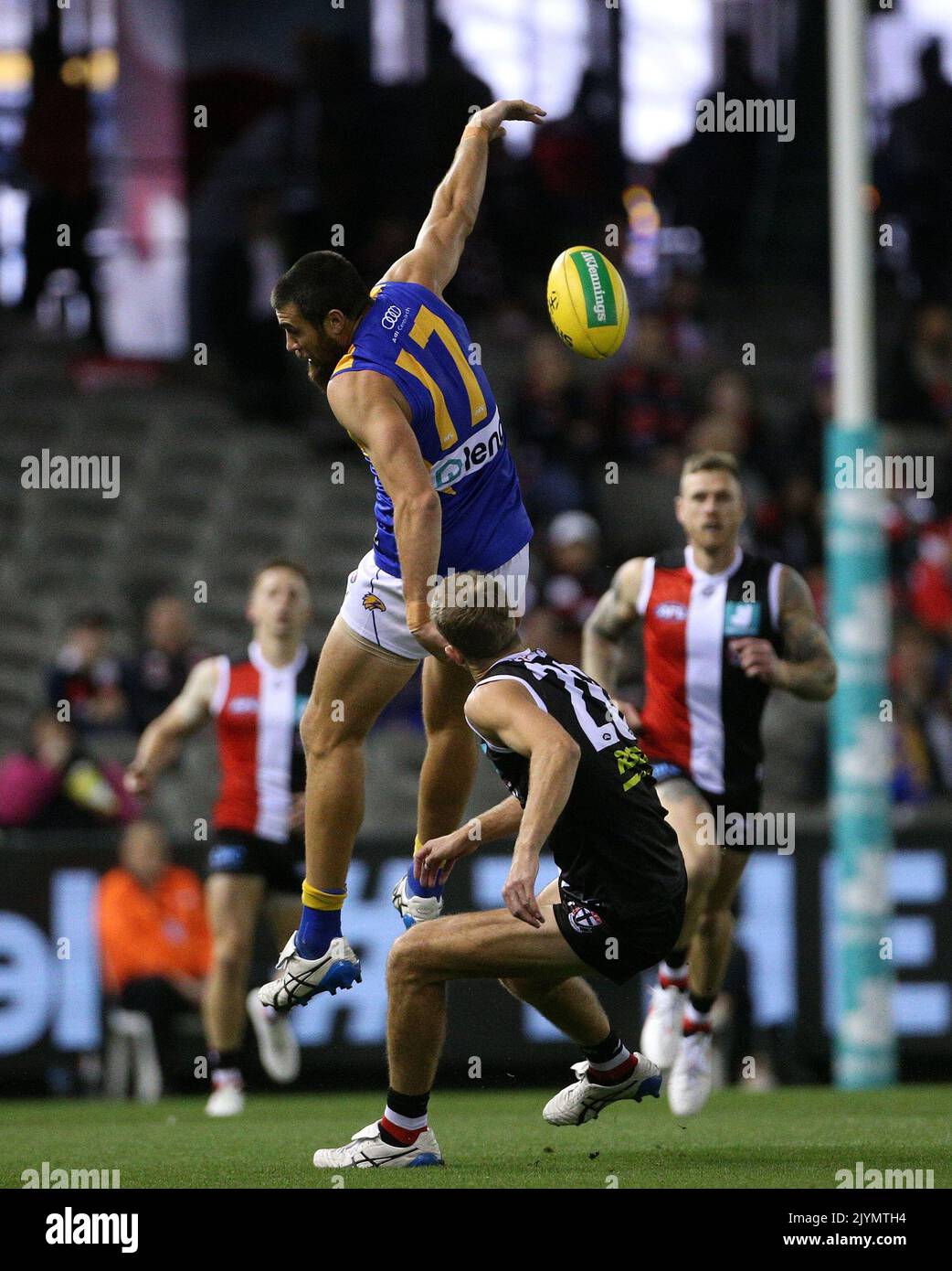 Josh Kennedy of the Eagles flies over Dougal Howard of the Saints ...