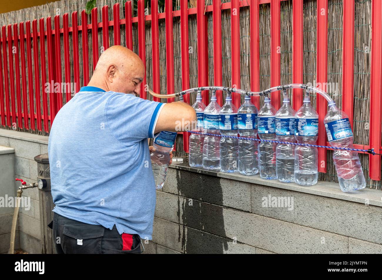 Refilling water bottles with delicious fresh drinking water from a ...