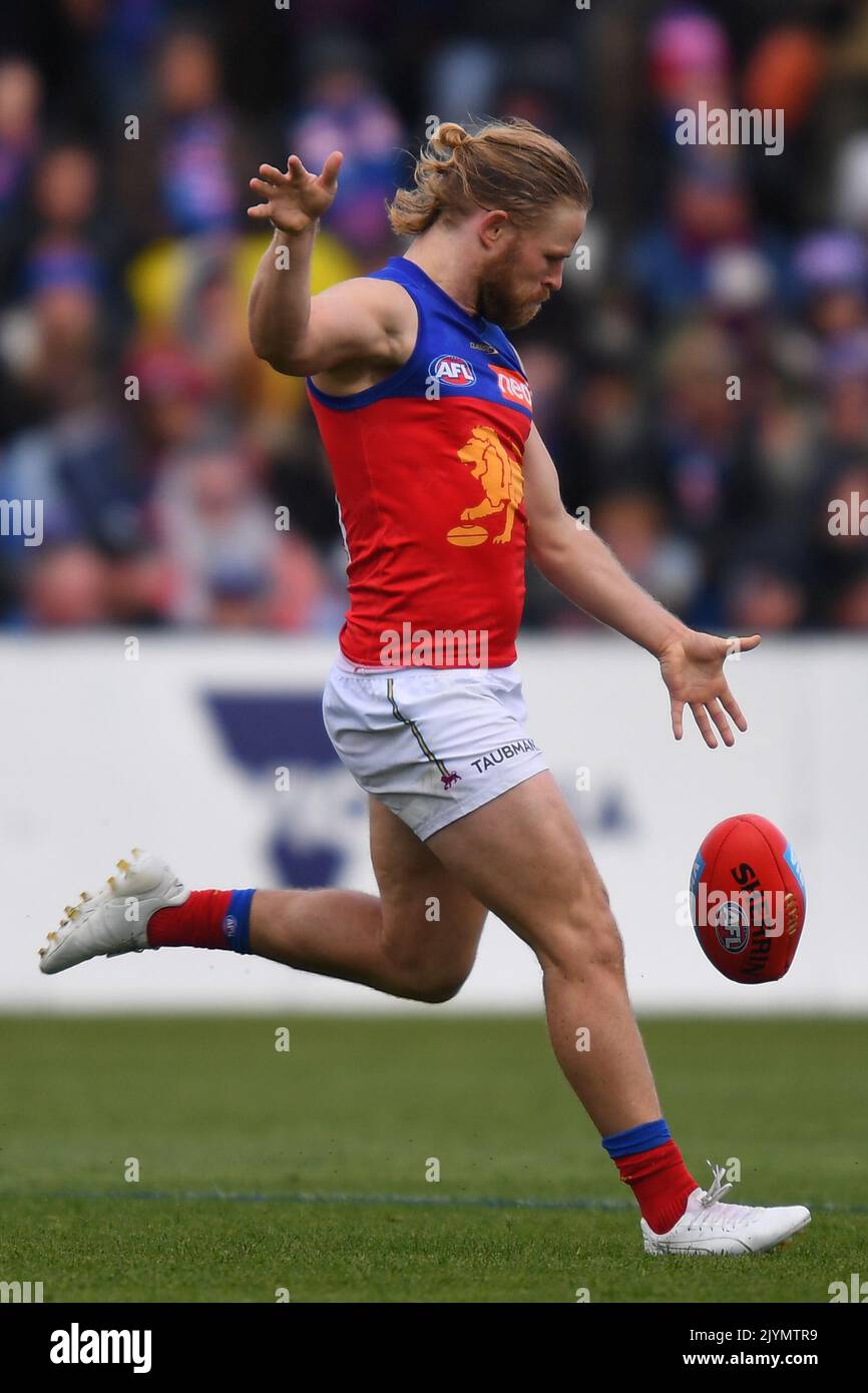 Daniel Rich of the Lions kicks the footy during the Round 4 AFL match ...