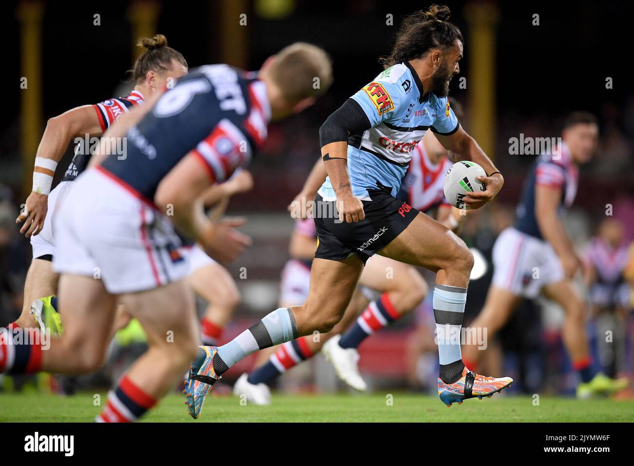 Toby Rudolf of the Sharks makes a break during the Round 5 NRL match ...