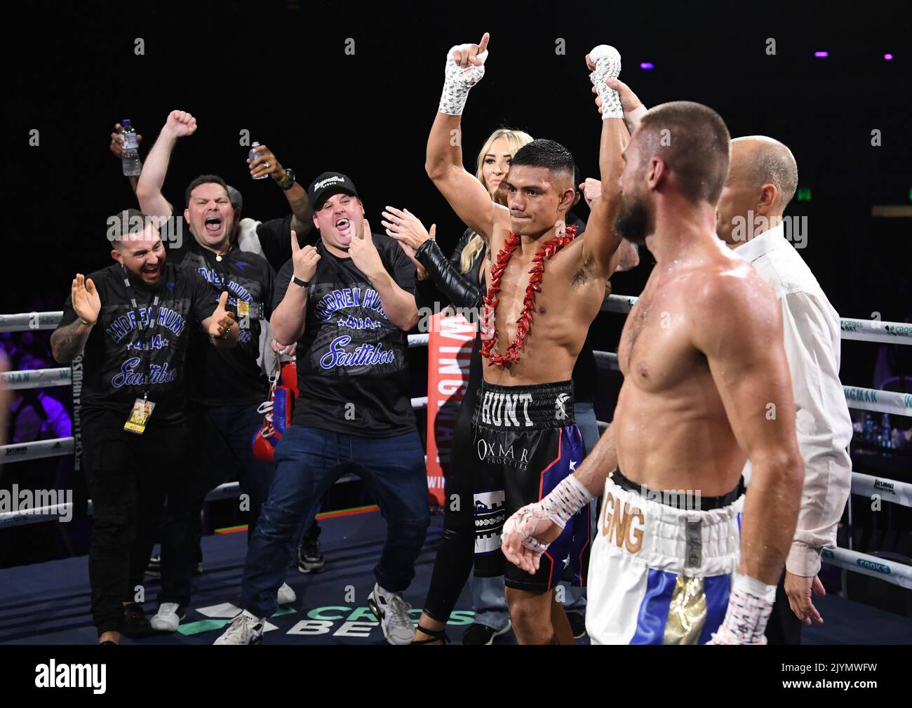 Andrew Hunt (centre) celebrates winning against Ben Kite during their ...