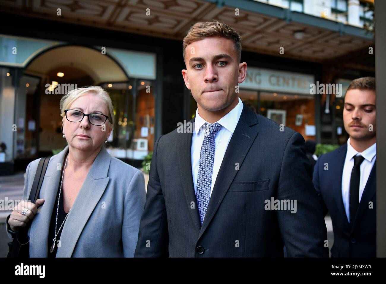 Rugby league player Callan Sinclair (right) leaves the Downing Centre ...