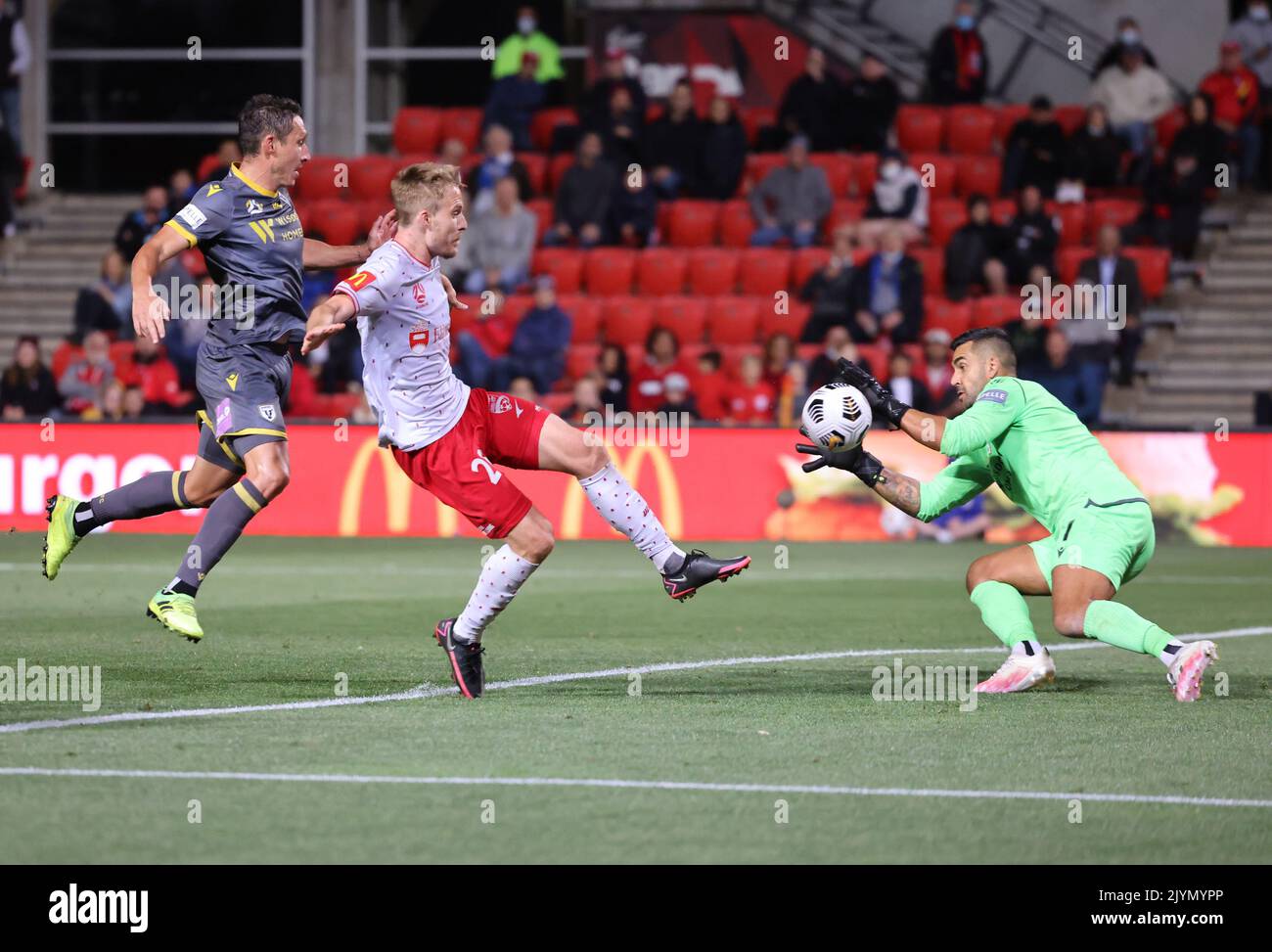 Goal keeper Adam Federici of Macarthur FC stops a ball from Benjamin ...