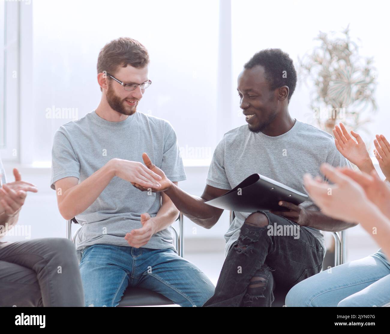 Young friends interacting other hi-res stock photography and images - Alamy